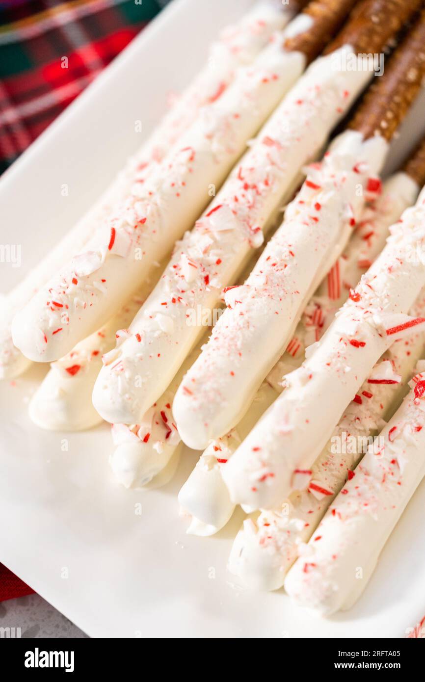 Candy cane chocolate covered pretzel rods Stock Photo - Alamy
