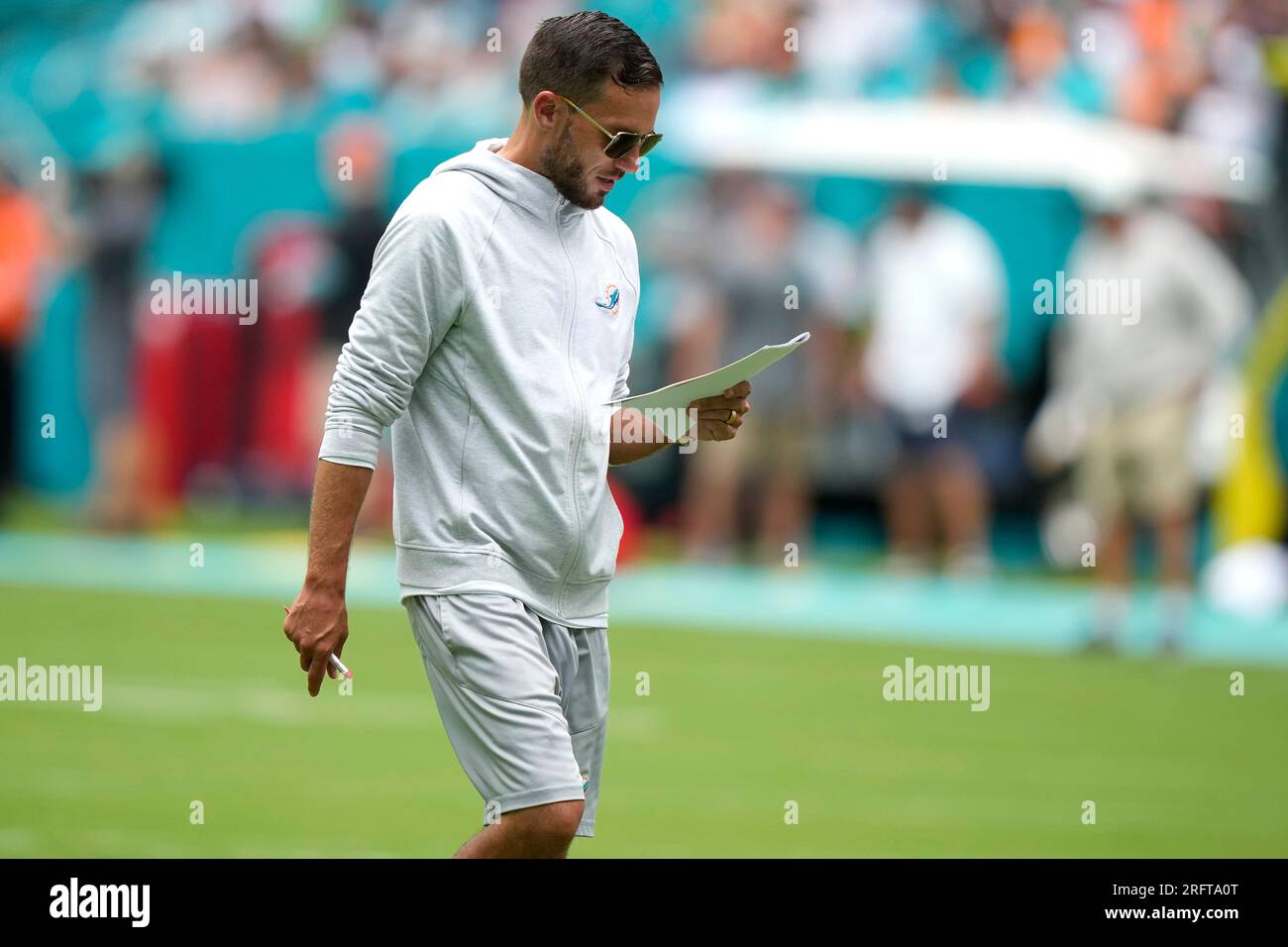 Miami Dolphins head coach Mike McDaniel watches drills during a team ...