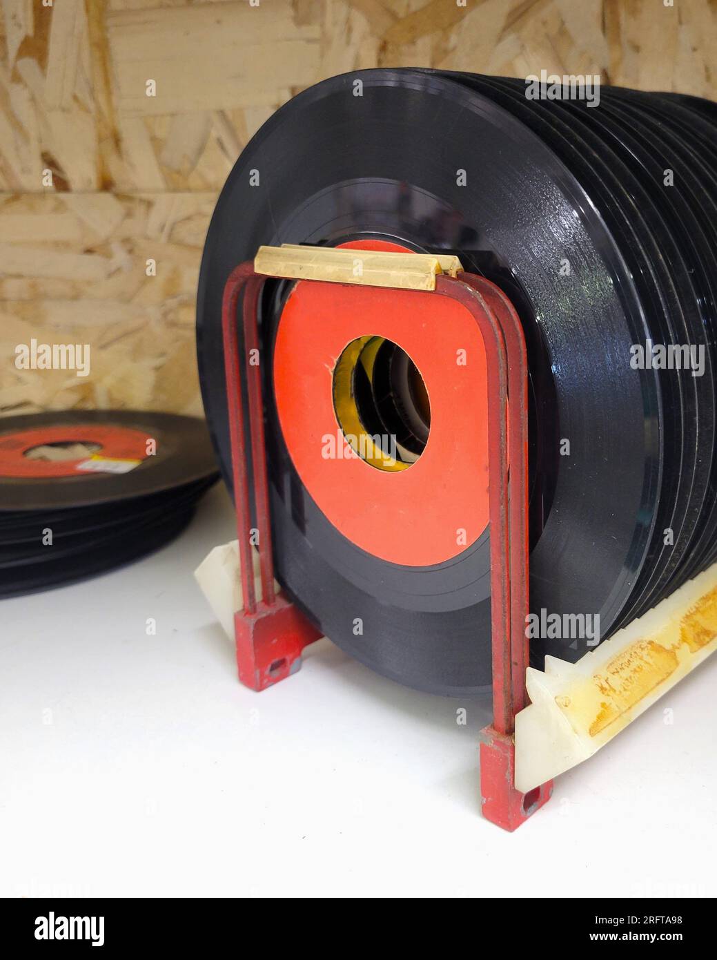 A collection of vintage 45 RPM (45's) records, displayed in a metal ...