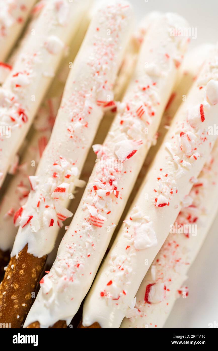 Candy cane chocolate covered pretzel rods Stock Photo - Alamy
