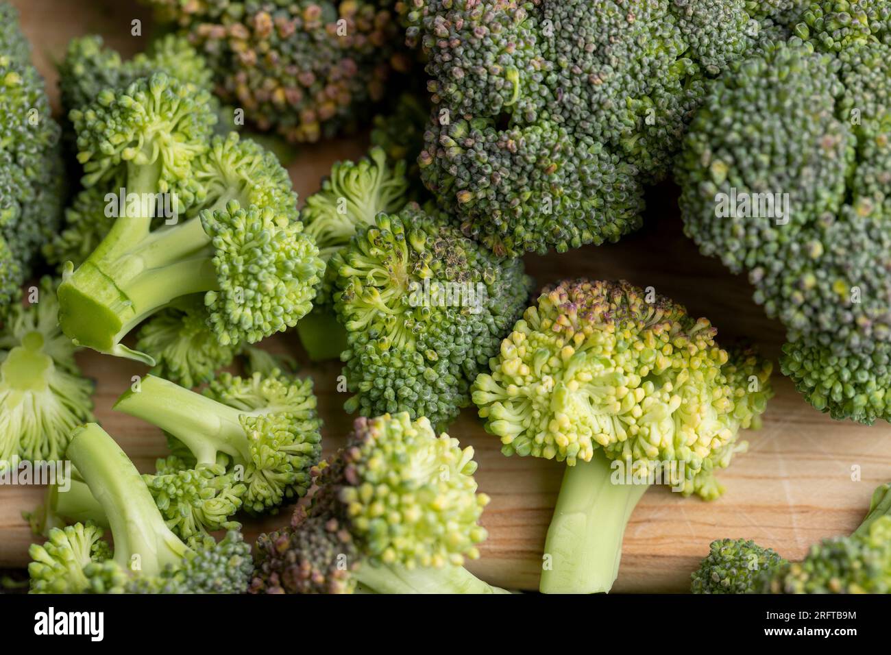 Green ripe broccoli in raw form, broccoli cabbage on the kitchen table ...