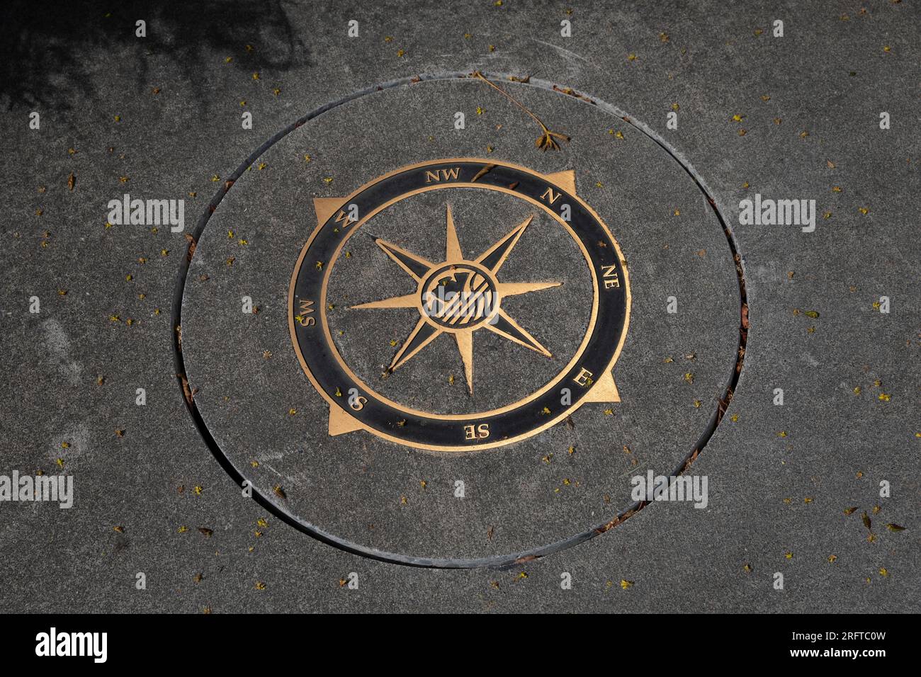 A manhole cover, locally known as a hatch cover, is embellished with a ...