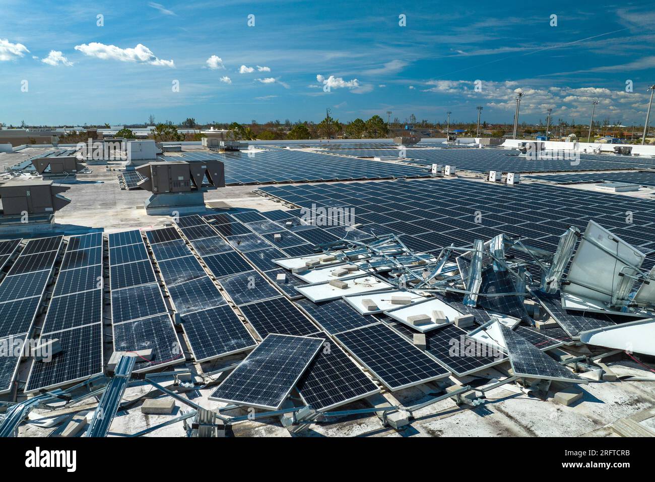 Aerial view of damaged by hurricane wind photovoltaic solar panels ...