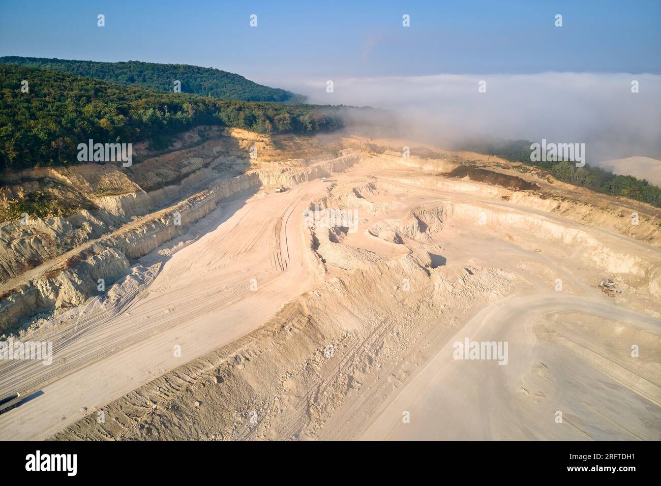 Aerial view of open pit mining site of limestone materials extraction ...