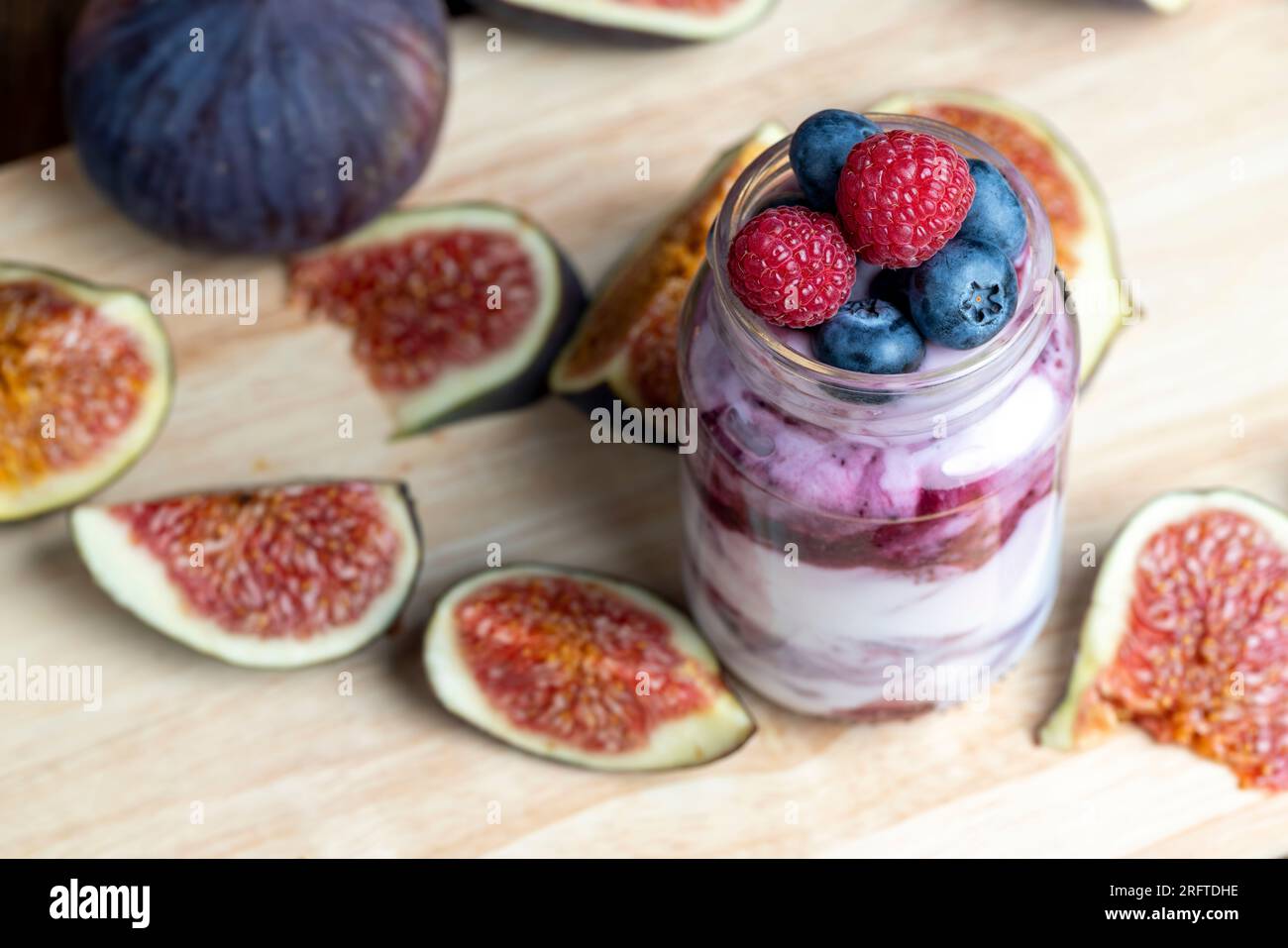 Fresh delicious milk yogurt with raspberry flavor, yogurt with red ...