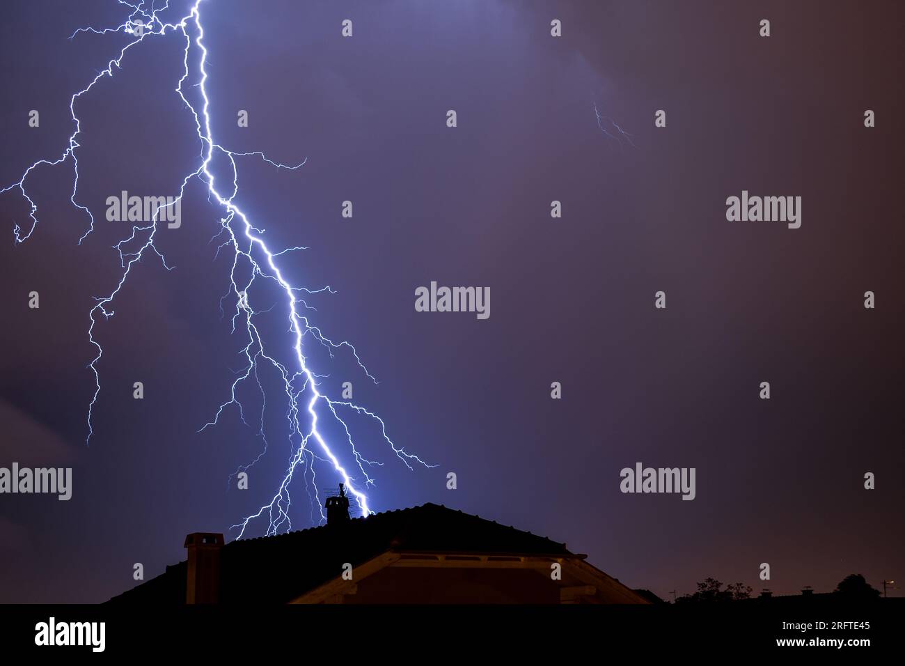 Powerful lightning strike above house roof in Croatia during storm ...