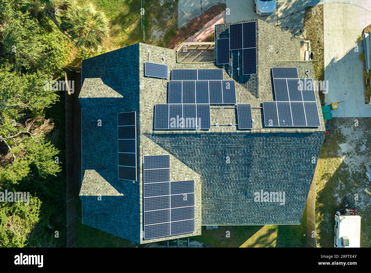 American residential house with rooftop covered with solar photovoltaic ...
