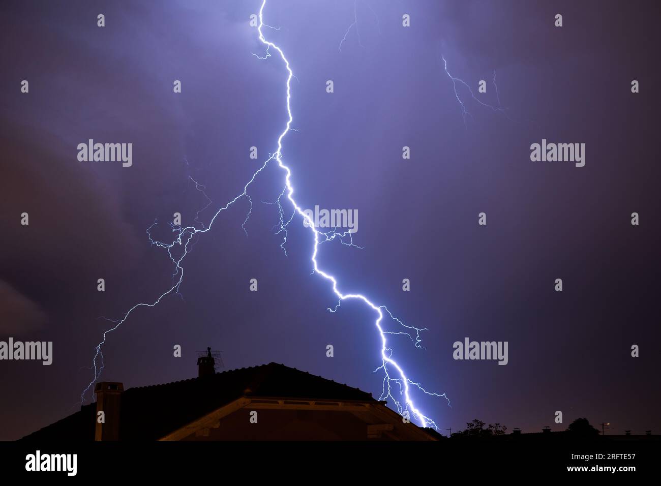 Powerful lightning strike above house roof in Croatia during storm ...