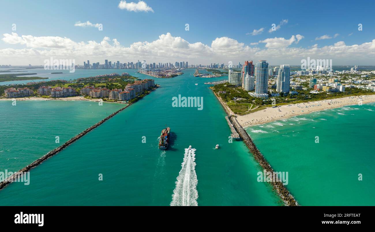 Commercial container ship entering Miami port harbor through main ...