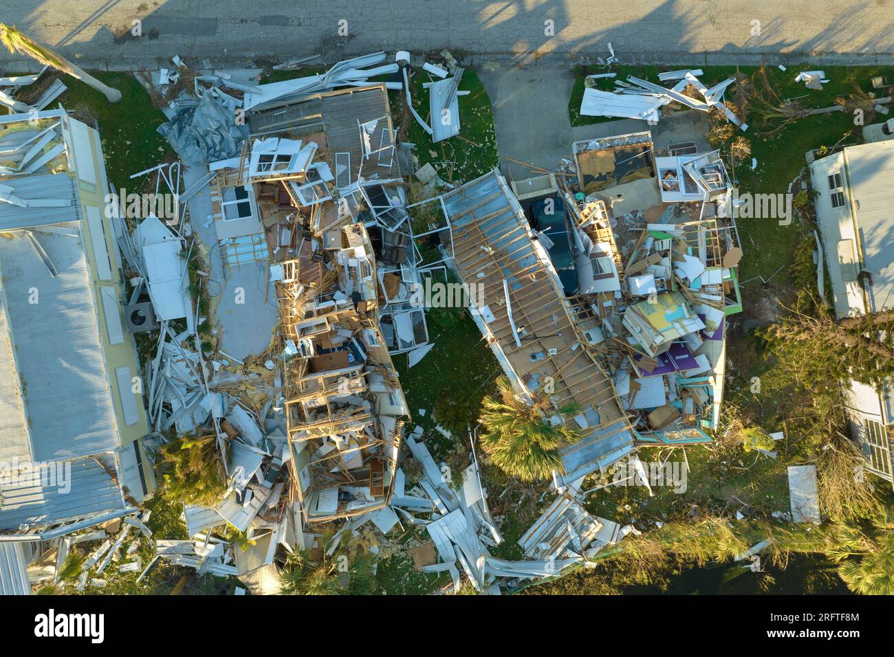Property damage from strong hurricane winds. Mobile homes in Florida residential area with ...