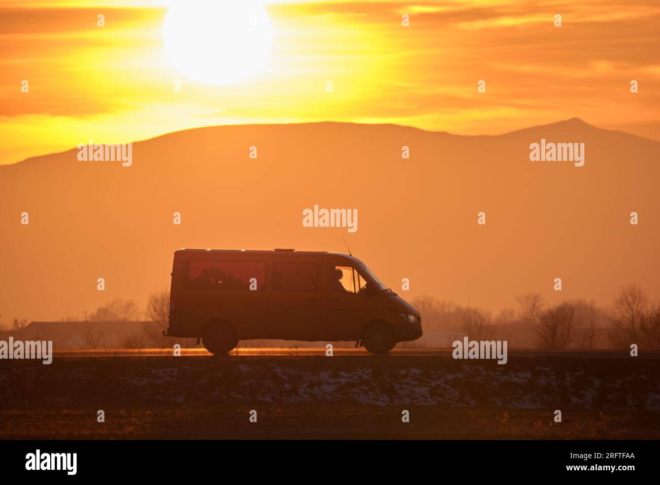 Small cargo van driving on highway hauling goods. Delivery ...