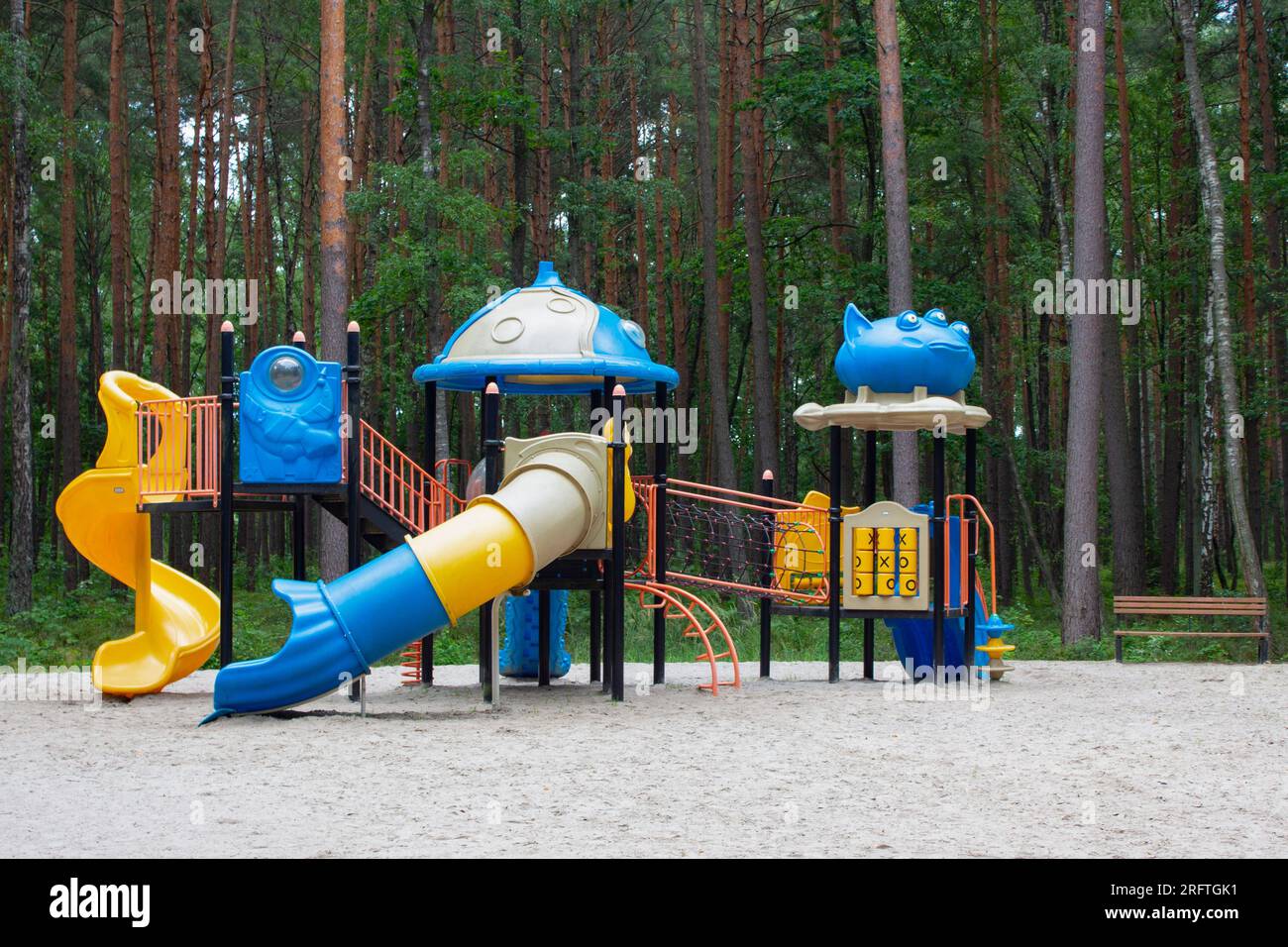 Colorful outdoor playground in the park. A safe modern playground. A ...
