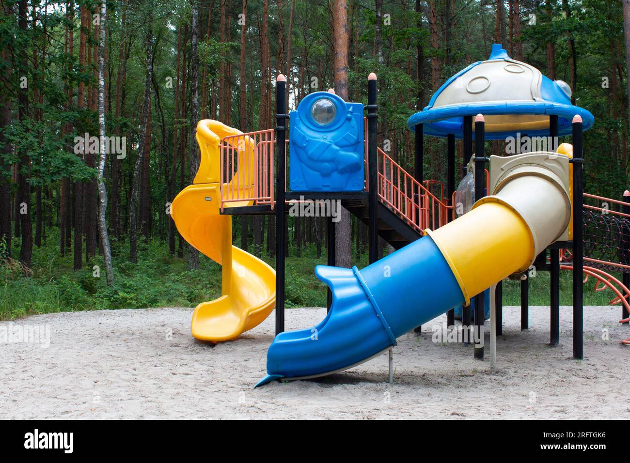 Colorful outdoor playground in the park. A safe modern playground. A ...
