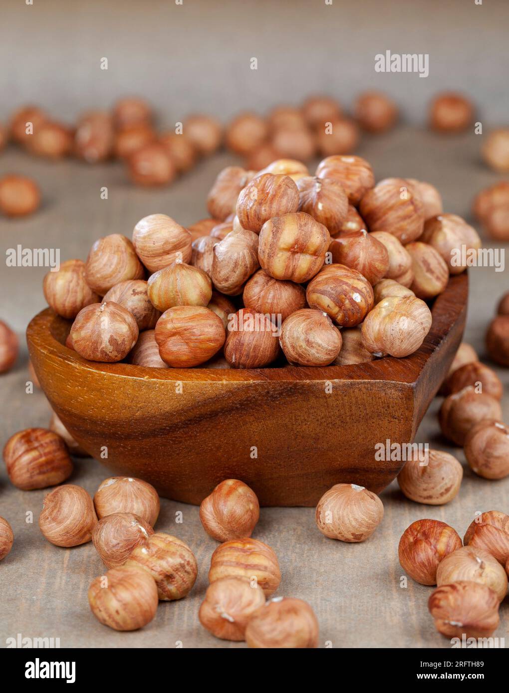 A pile of hazelnuts on the table, fresh peeled hazelnut kernels on the ...