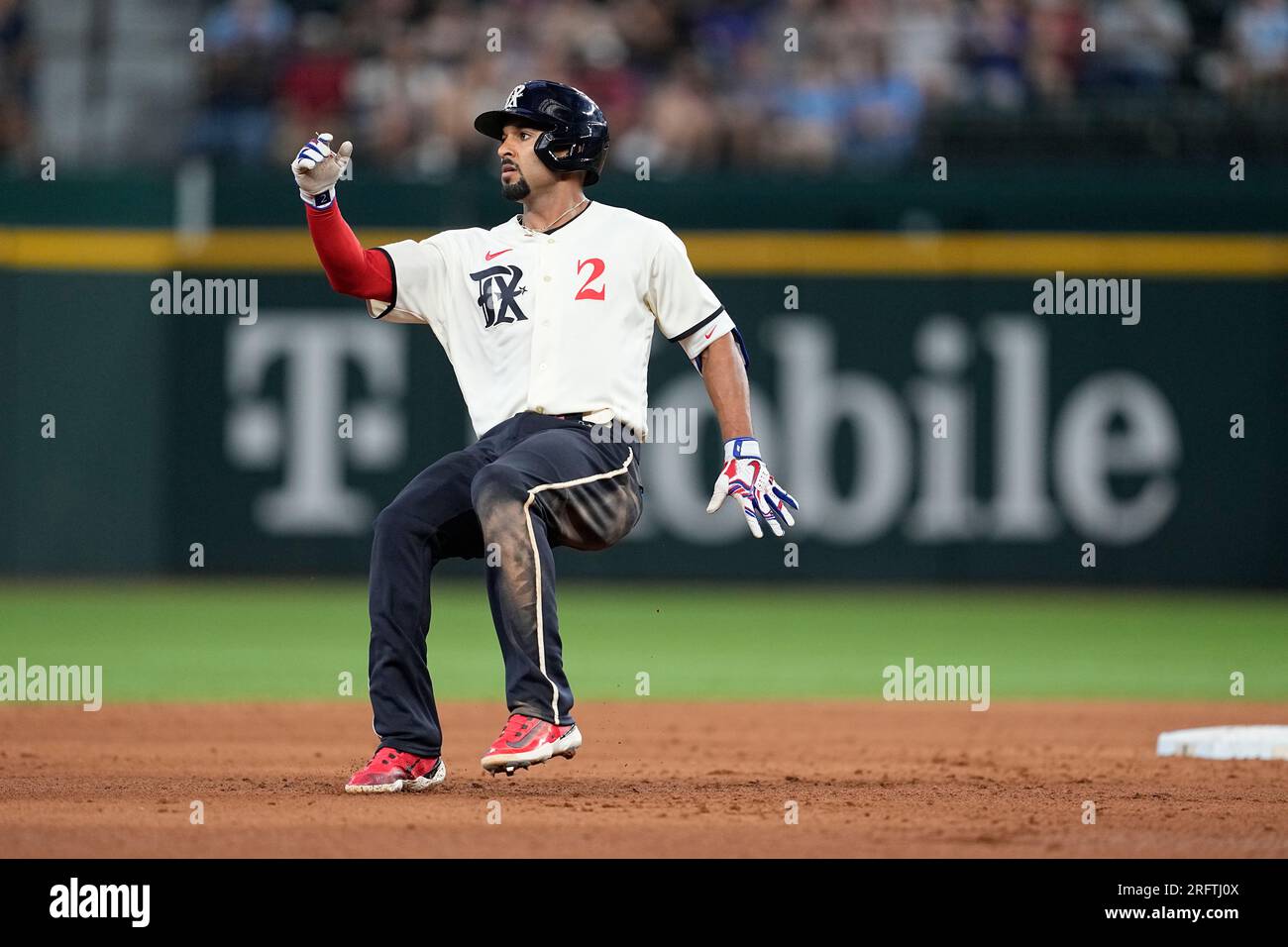 Texas Rangers' Marcus Semien holds up after rounding second on his ...