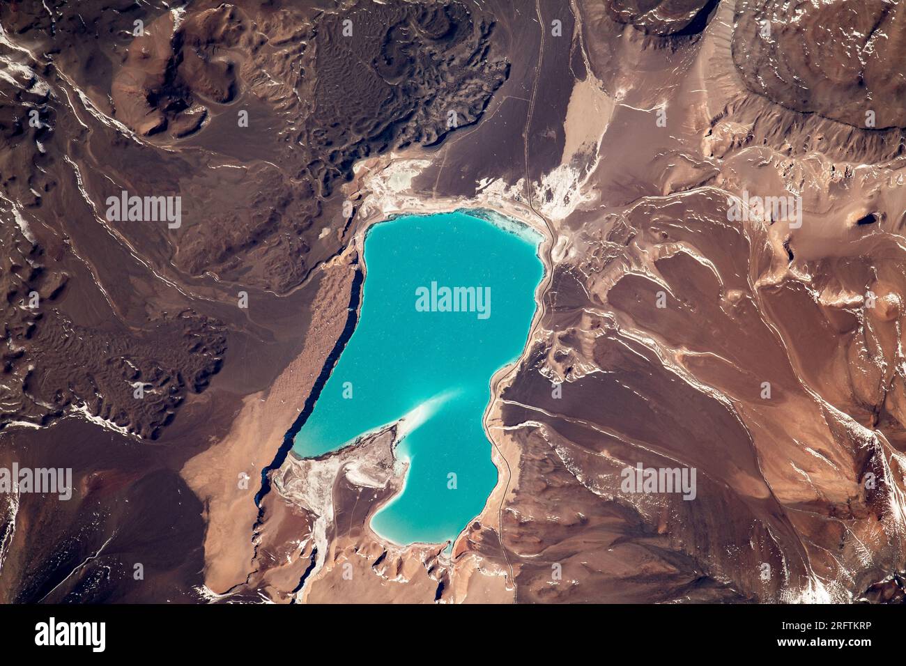 Aerial of Laguna Verde, a high-altitude lake in the Andes mountains of ...