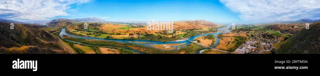 WIde scenic aerial panorama of Waitaki river stream in valley at Kurow ...