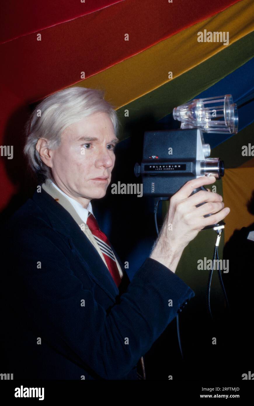 Pop artist Andy Warhol with a Polaroid Polavision instant movie camera ...