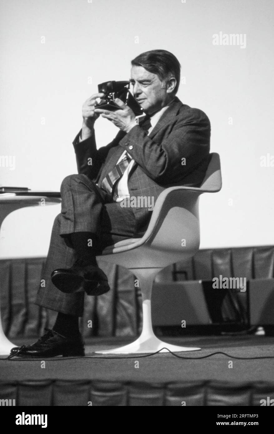 Edwin H. Land - inventor of the Polaroid Land camera - takes a photo ...