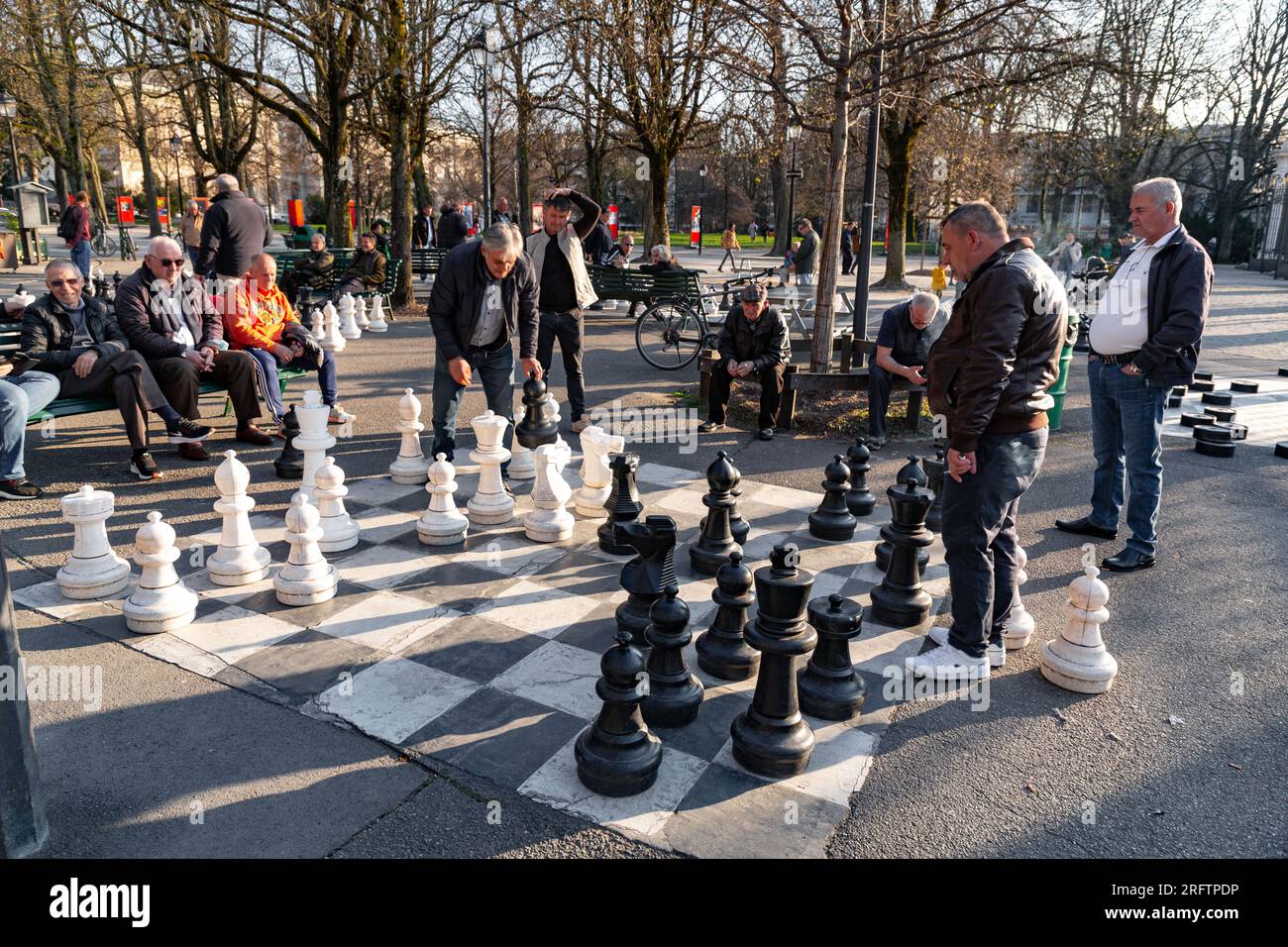 Geneva, Switzerland - 24 March 2022: Group of people playing chess game ...