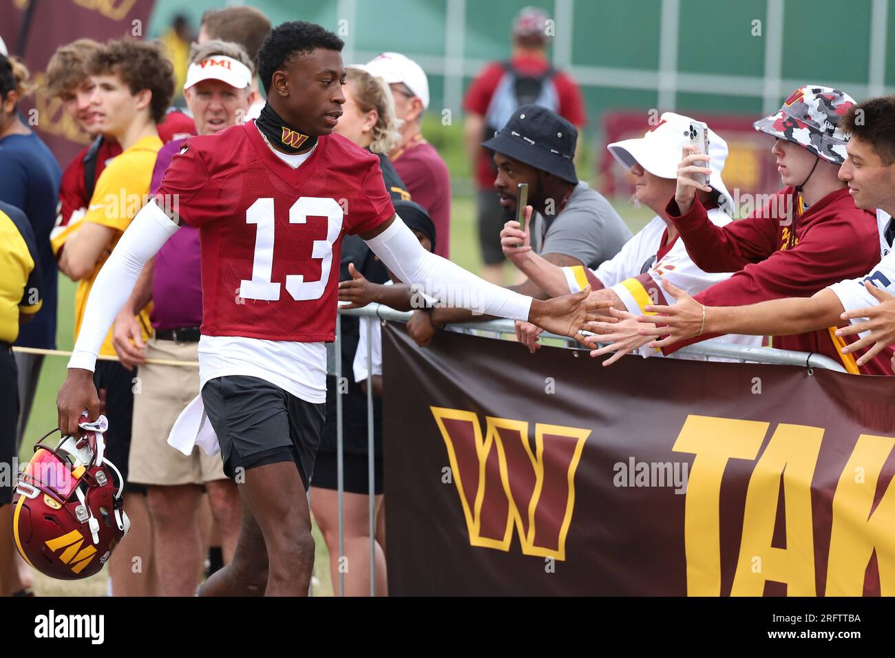 Washington Commanders Cornerback Emmanuel Forbes (13) greets fans as he ...