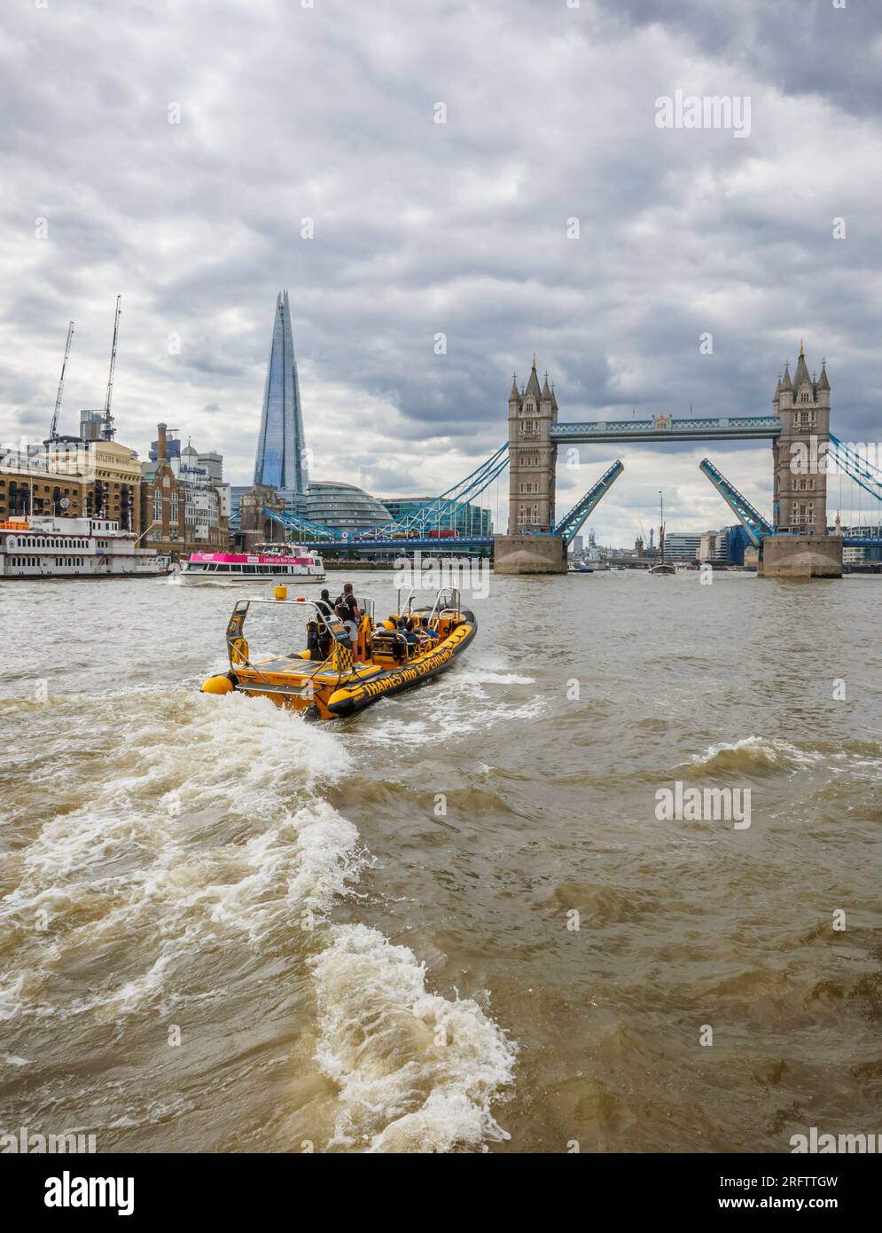 A Thames Rib Experience speedboat on the River Thames speeds towards ...