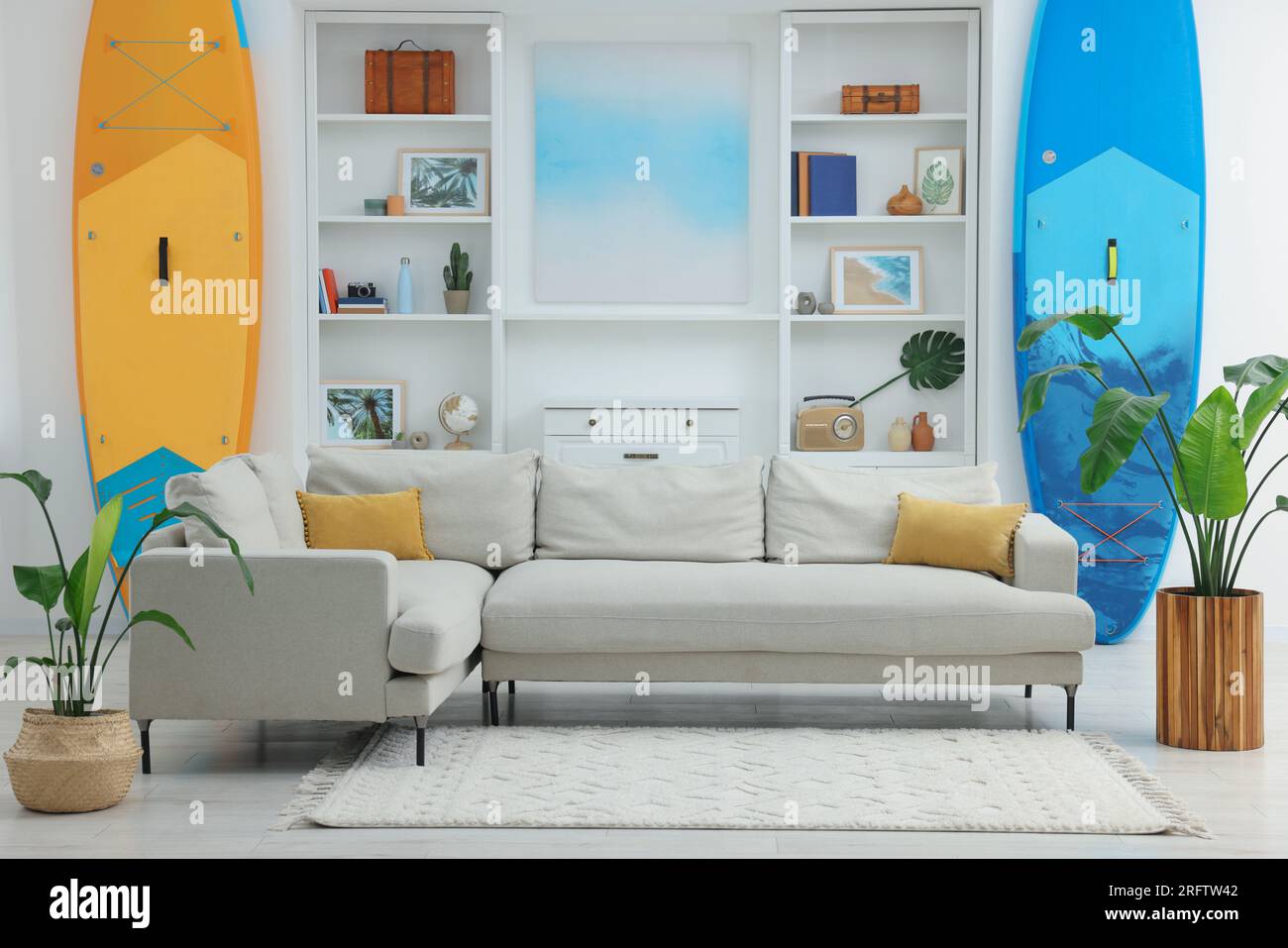 SUP boards, shelving unit with different decor elements and stylish ...