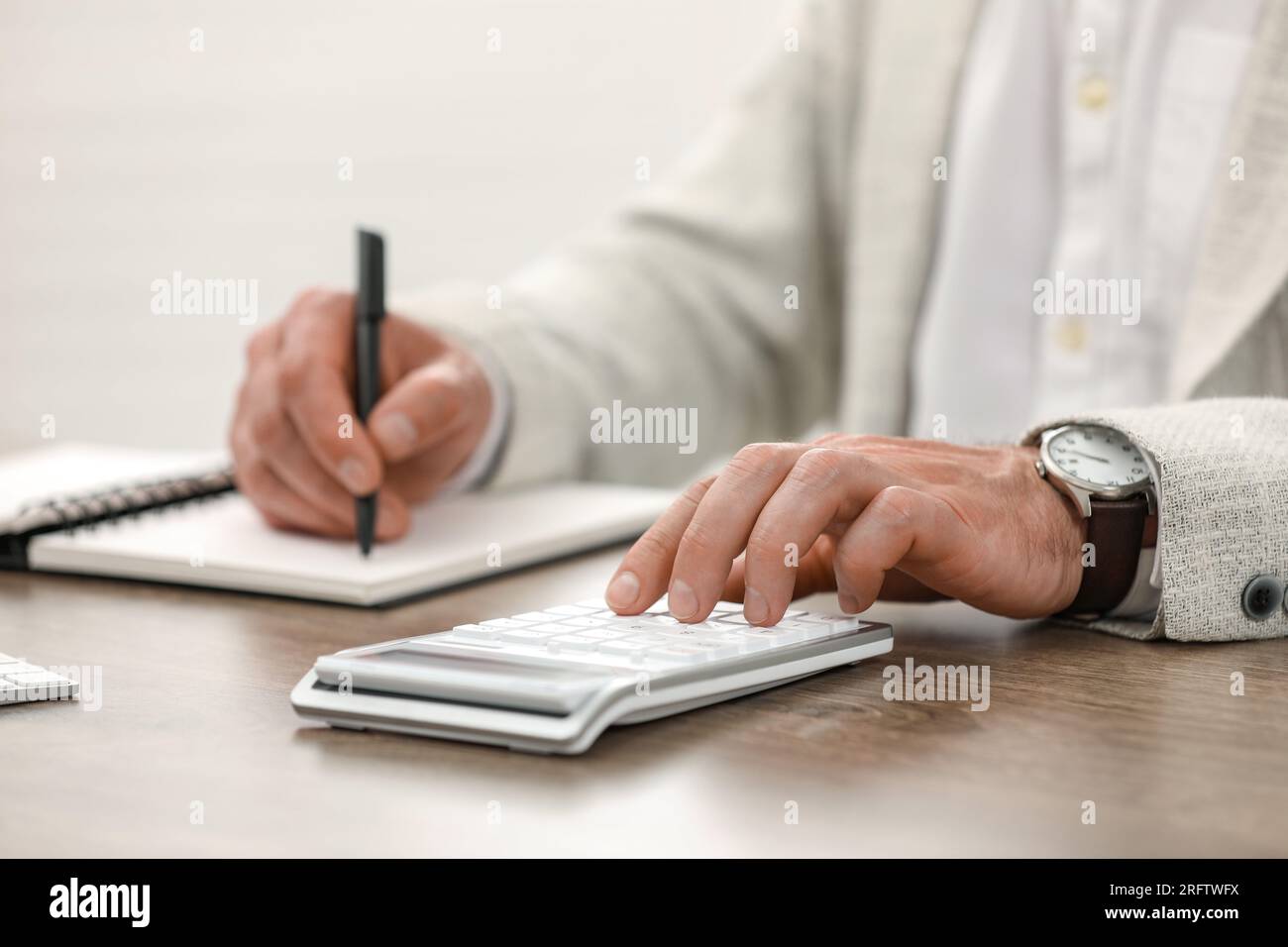 Accountant using calculator hi-res stock photography and images - Alamy