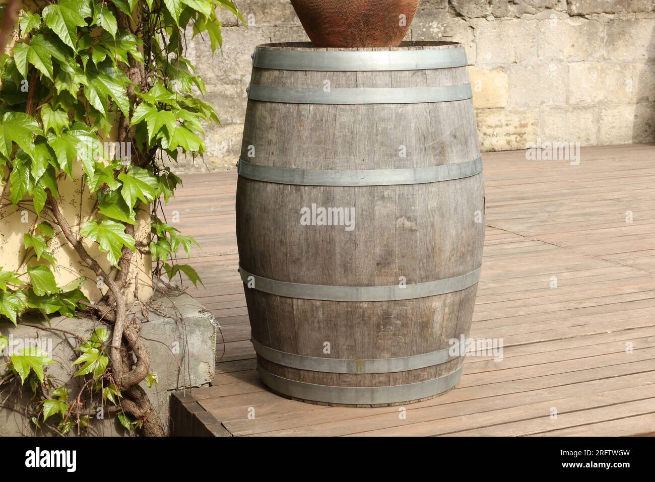 Traditional wooden barrel on street outdoors. Wine making Stock Photo ...