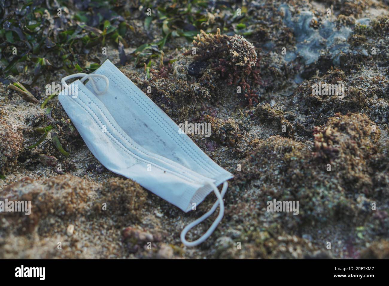 Mask waste on the beach, corona virus medical mask waste Stock Photo ...