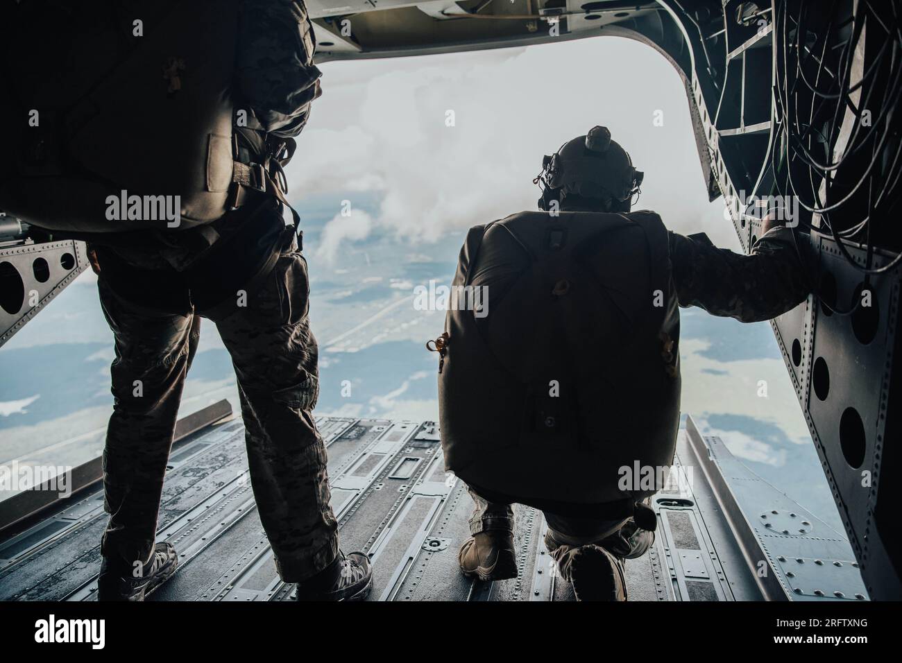 U.S. Army Paratroopers prepare to jump from high altitude, low opening ...