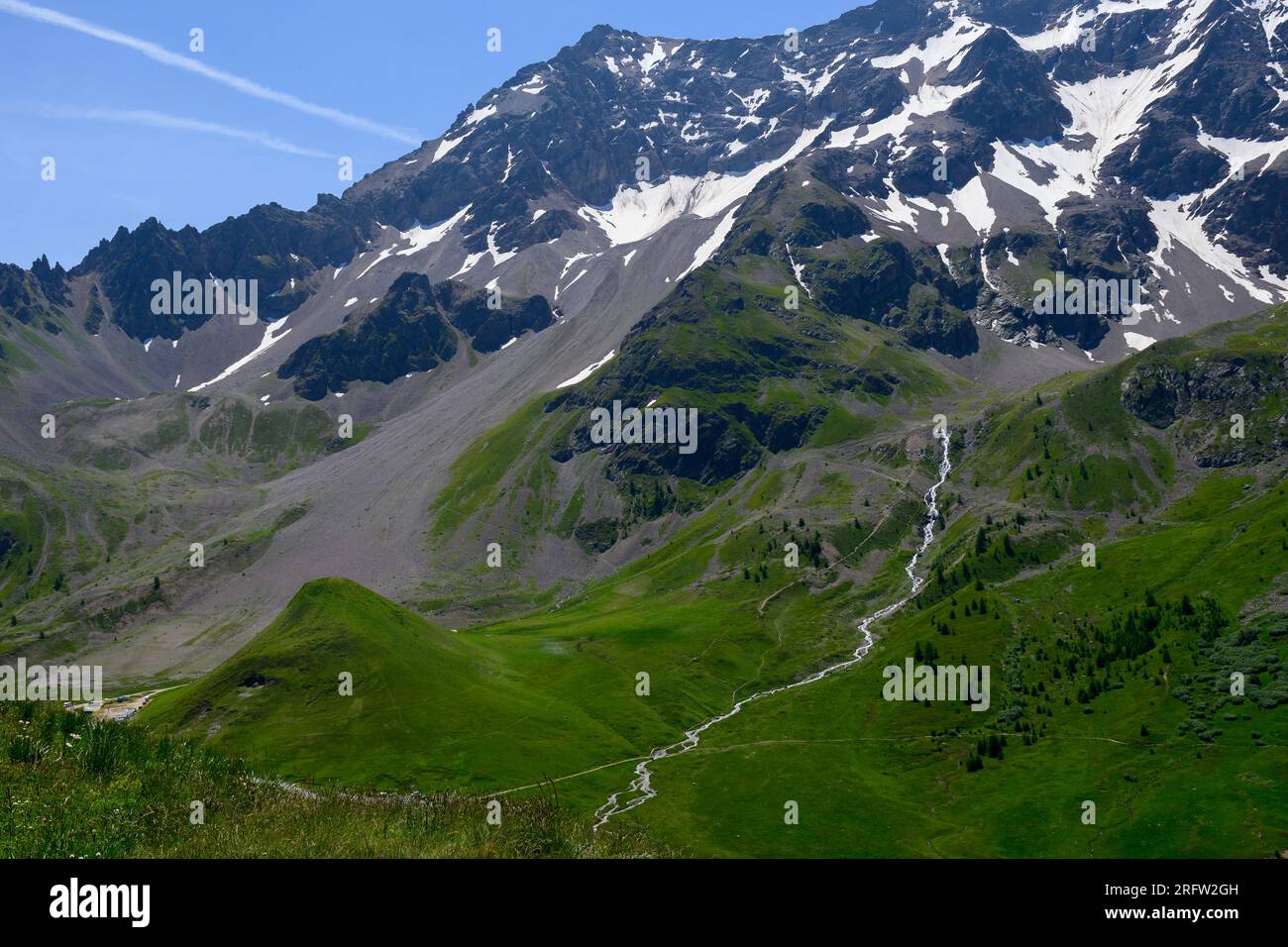 Mountains and green alpine meadows views near Col du Lautaret, Massif ...