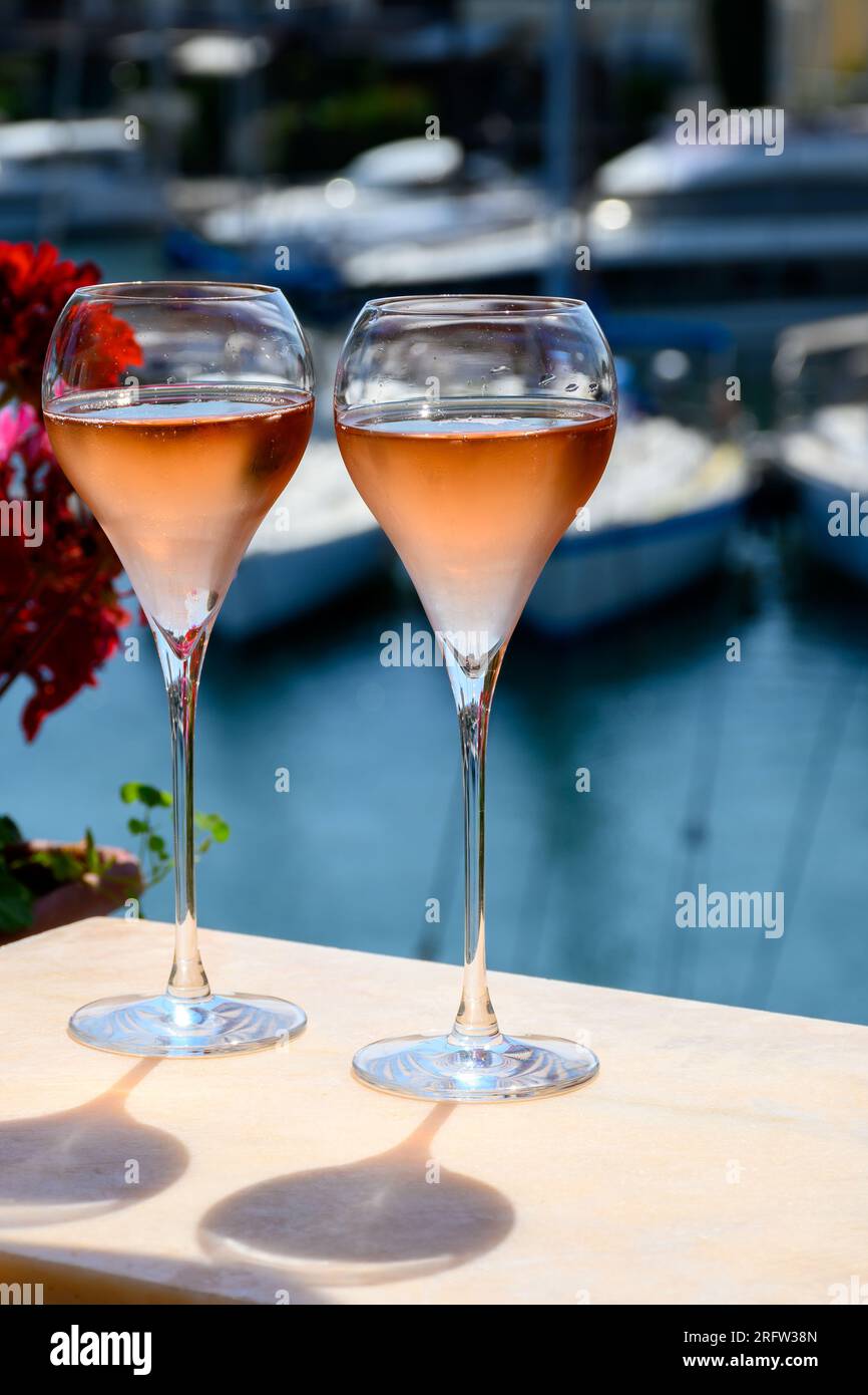 Summer party, drinking of French brut rose champagne sparkling wine in ...
