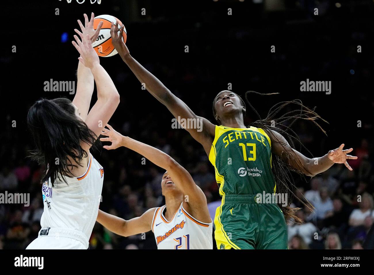 Seattle Storm center Ezi Magbegor (13) has her shot blocked by Phoenix ...