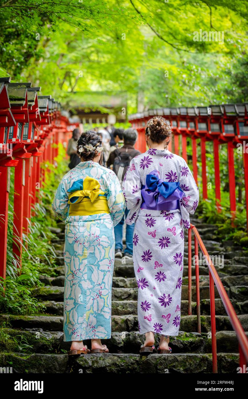 Back view of two women wearing Japanese yukata summer kimono in Kifune ...
