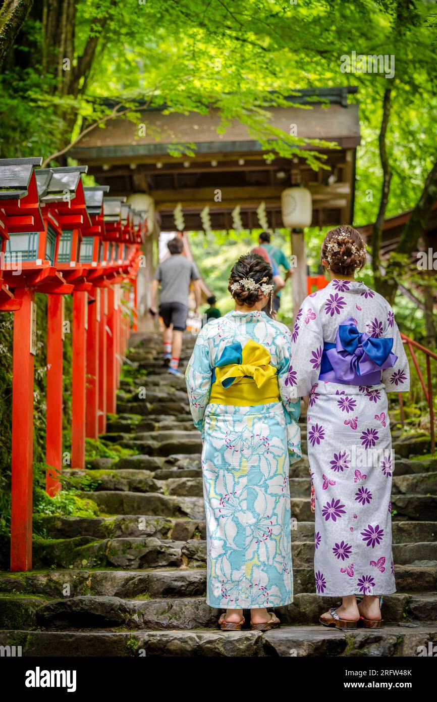 Back view of two women wearing Japanese yukata summer kimono in Kifune ...