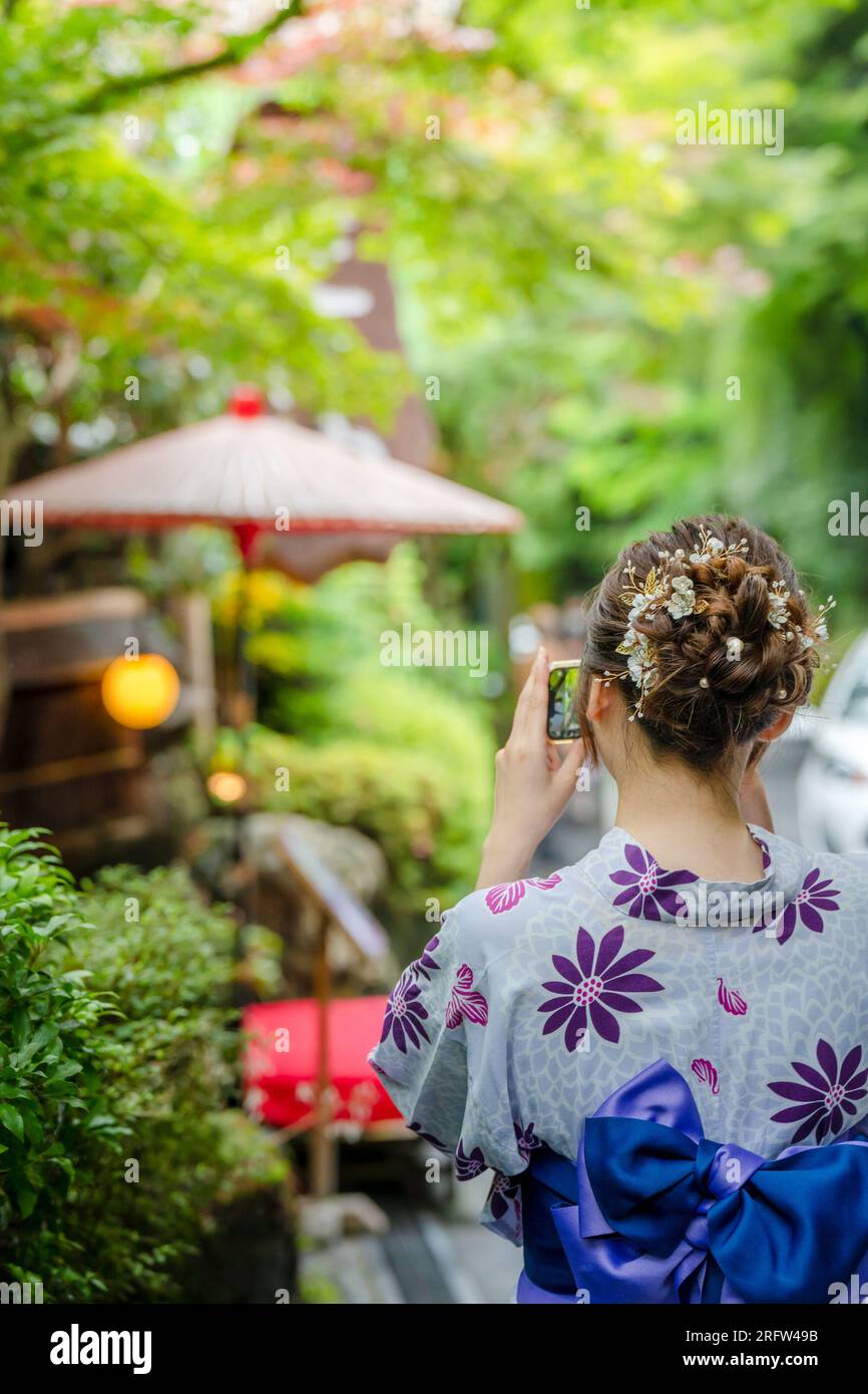 Back view of one woman wearing Japanese yukata summer kimono in Kifune ...