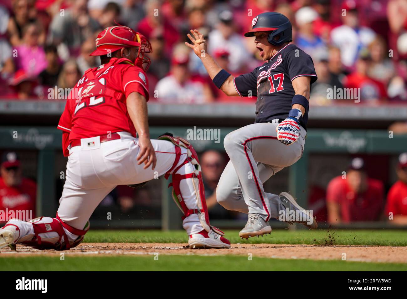 Washington Nationals' Alex Call, right, scores ahead of the tag from ...