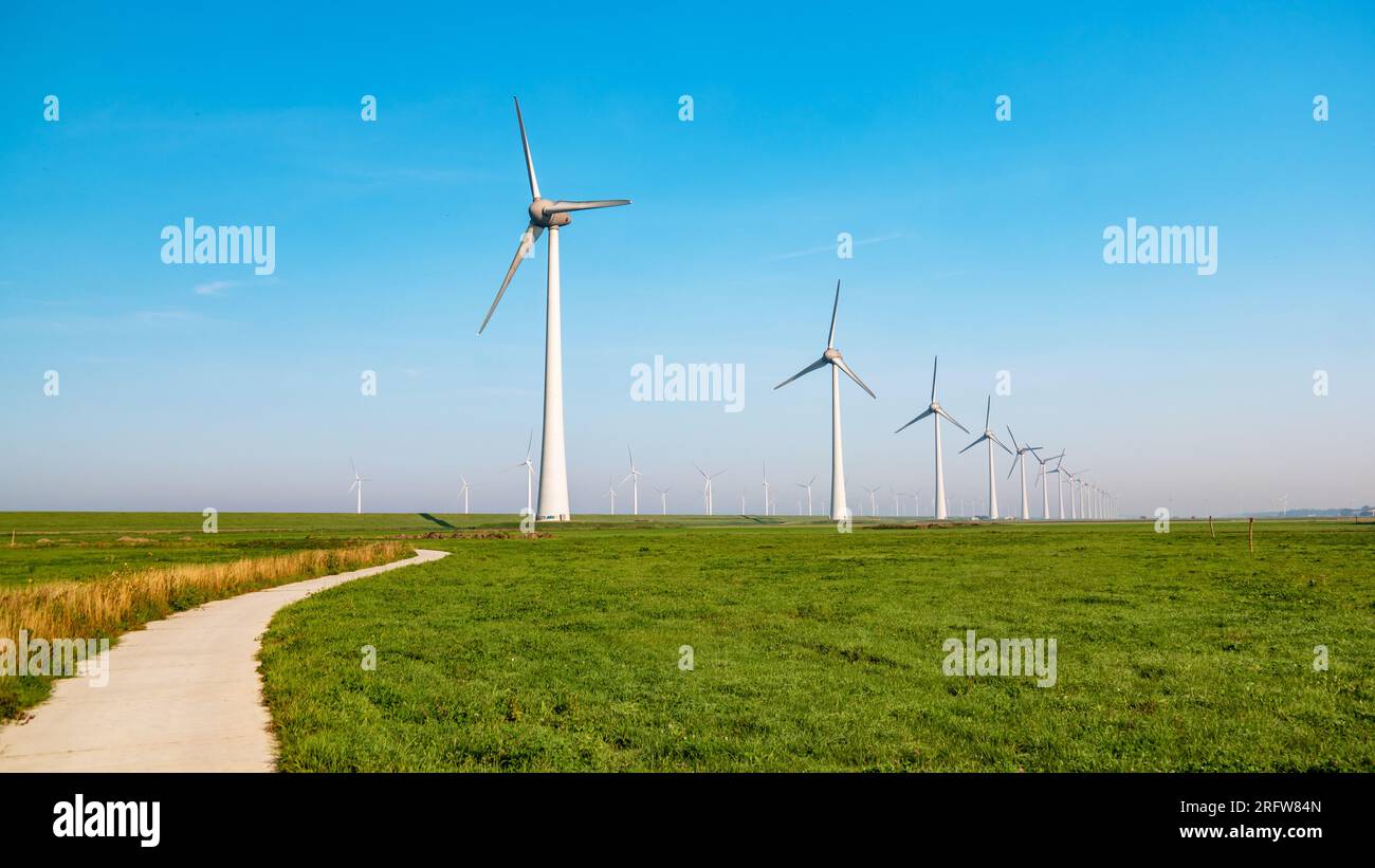 Windmill park with clouds and a blue sky, windmill park green energy on ...