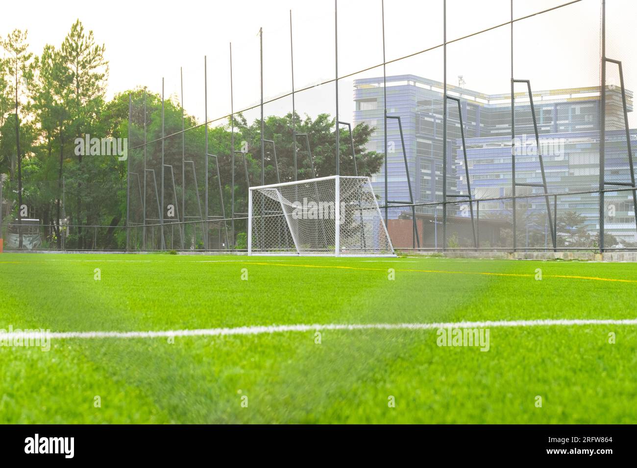 A soccer field view from outside the fence, focusing on the field ...