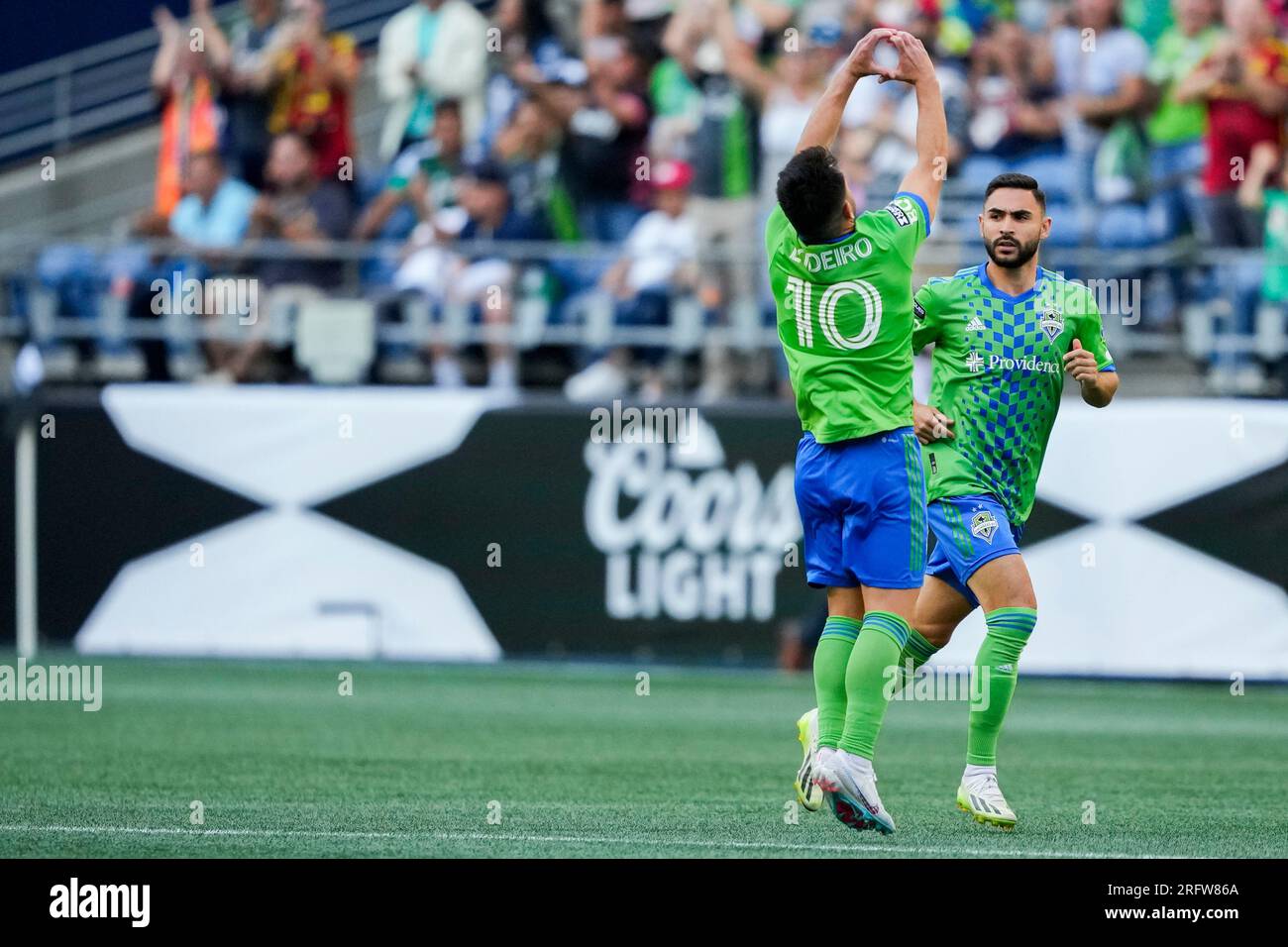 Seattle Sounders midfielder Nicolás Lodeiro (10) makes a heart after ...