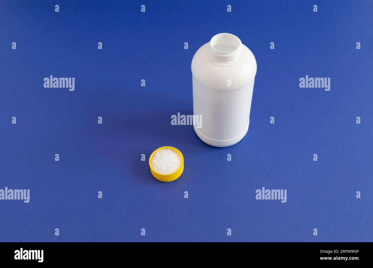 Closeup White Plastic Bottle, Cap Filled With Pipe Cleaner Granules In ...