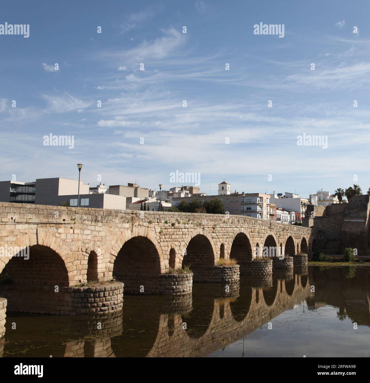 Puente Romano is a Roman Arch Bridge in the town of Merida Spain Stock ...