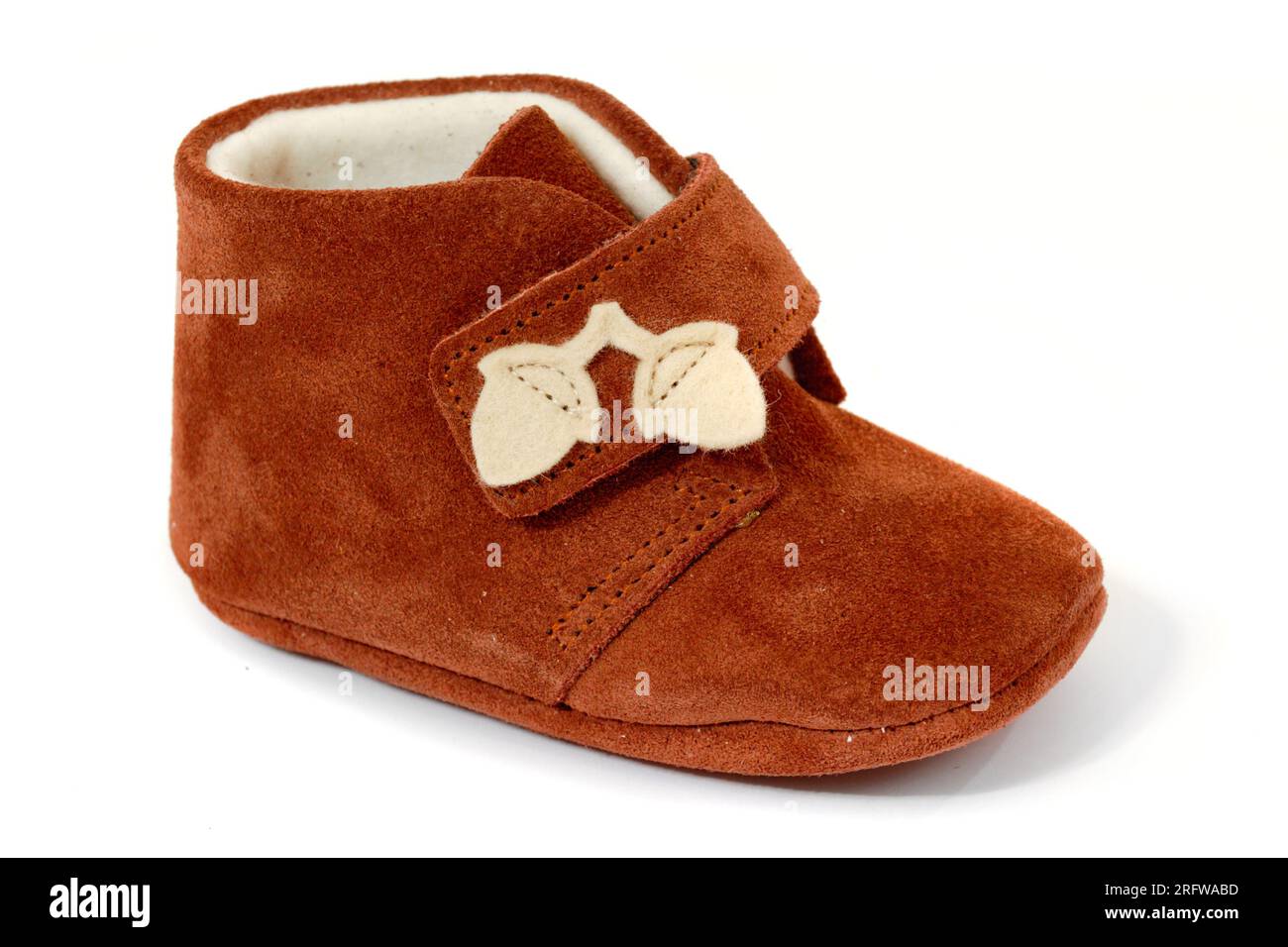 A sweet baby shoe taken on a clean white background Stock Photo - Alamy