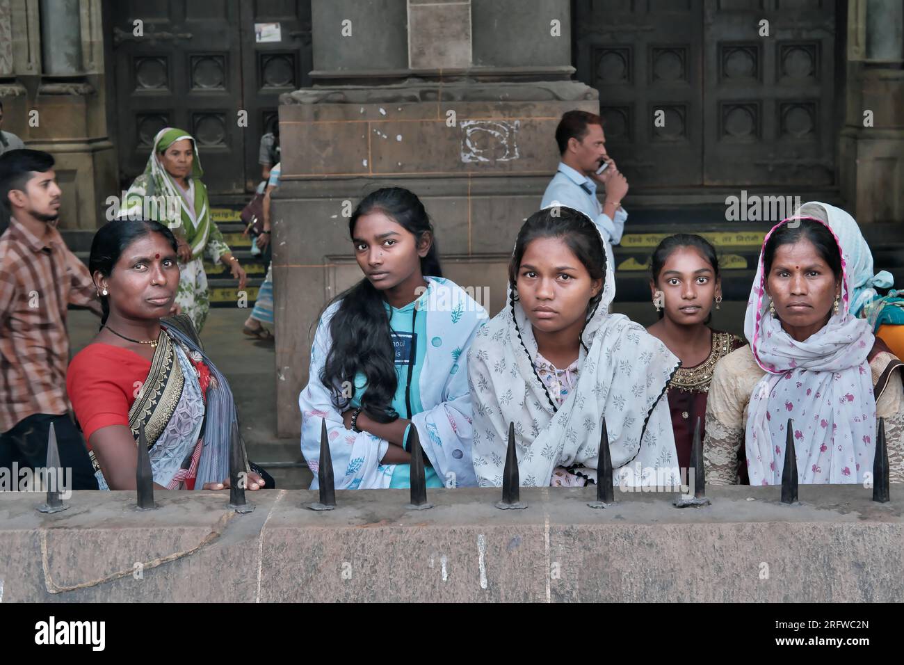 A group of five women, young and old, stand outside Chhatrapati Shivaji ...