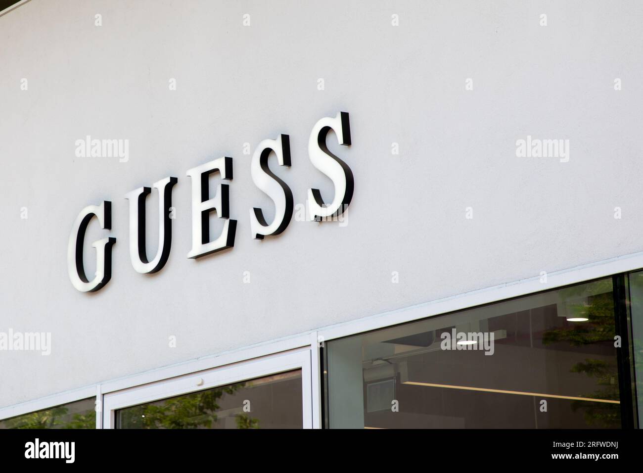 Milan , Italy - 07 15 2023 : Guess storefront text signage and logo ...