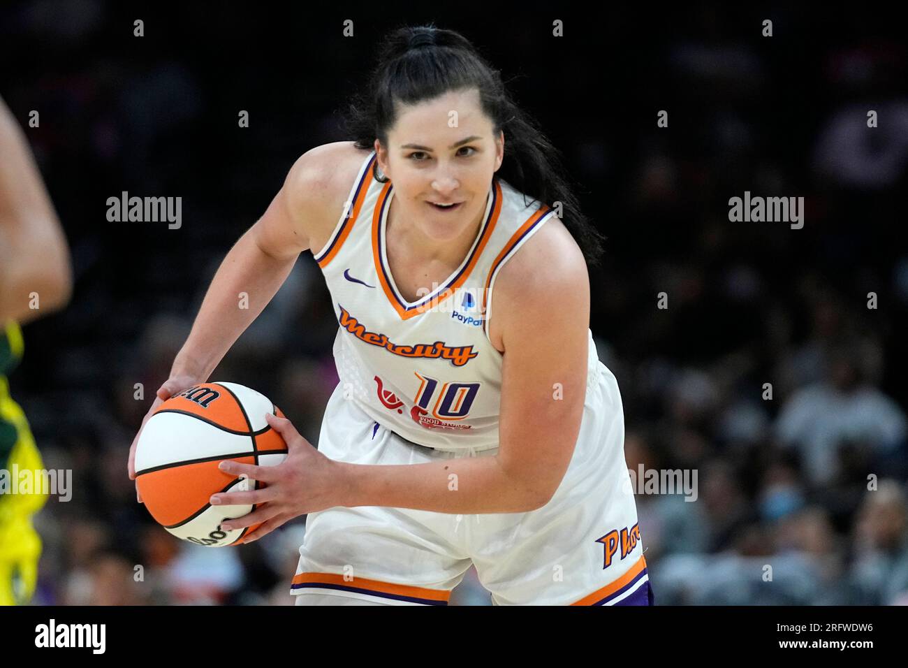 Phoenix Mercury center Megan Gustafson pauses with the ball against the ...