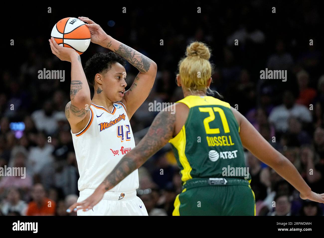 Phoenix Mercury center Brittney Griner (42) looks to pass the ball as ...