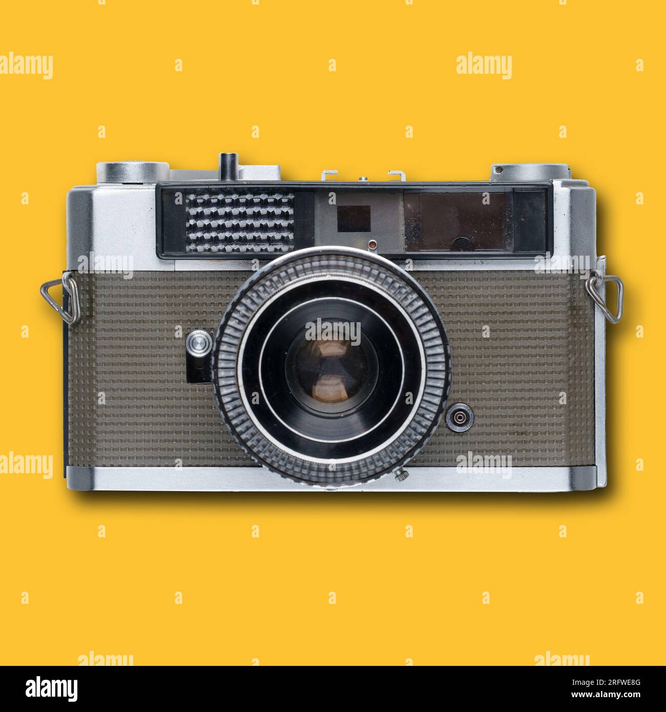 vintage old film camera on yellow background with shadow Stock Photo ...