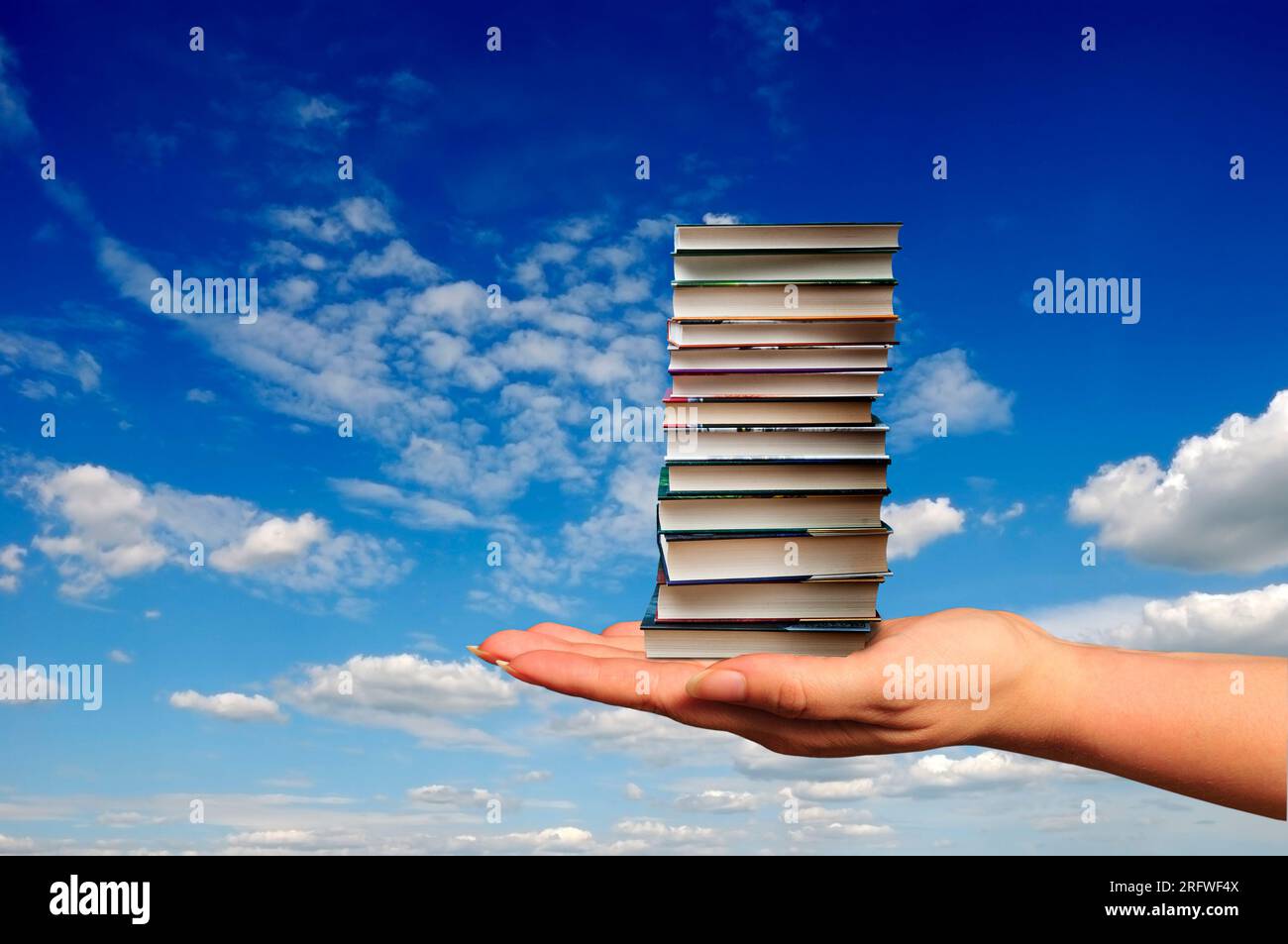 Hand holding books hi-res stock photography and images - Alamy